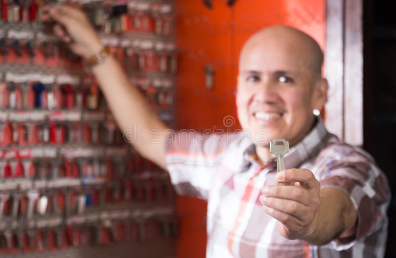Workman Hanging New Key on Stand in Locksmith Stock Photo - Image of ...