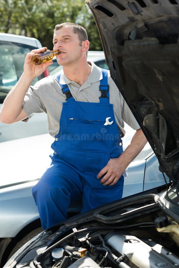 Workman having beer break stock photo. Image of contractor - 151238696