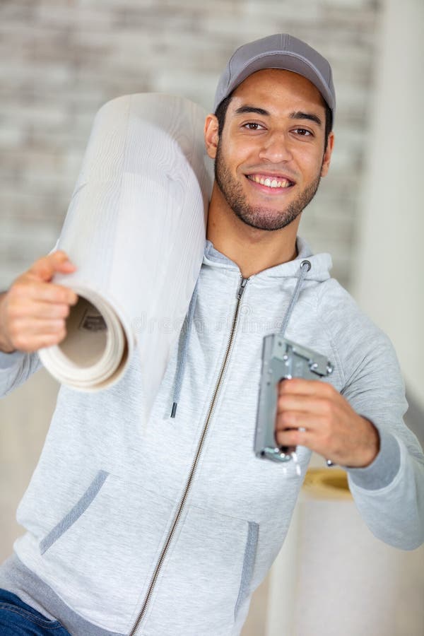 Workman Holding Roll Materials and Staple-gun Stock Image - Image of ...