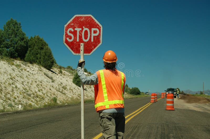 Workman holding stop sign stock photo. Image of laborer - 7246596