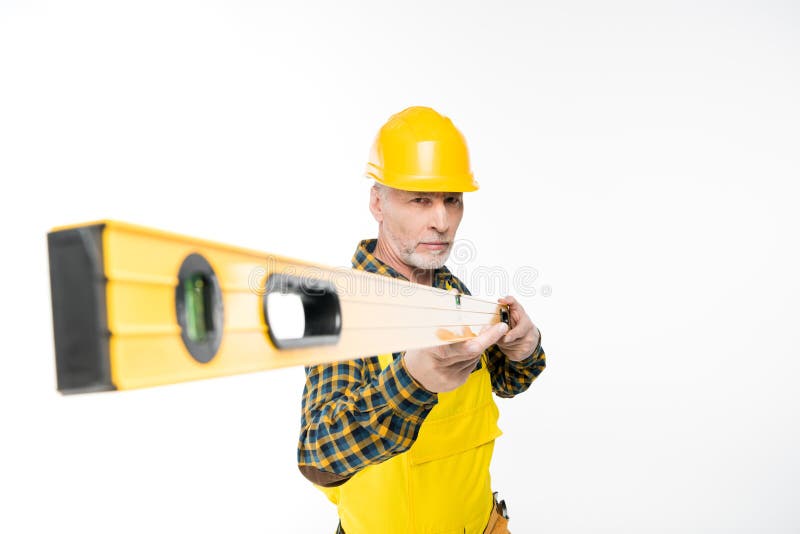 Workman with level tool stock photo. Image of industry - 90272200