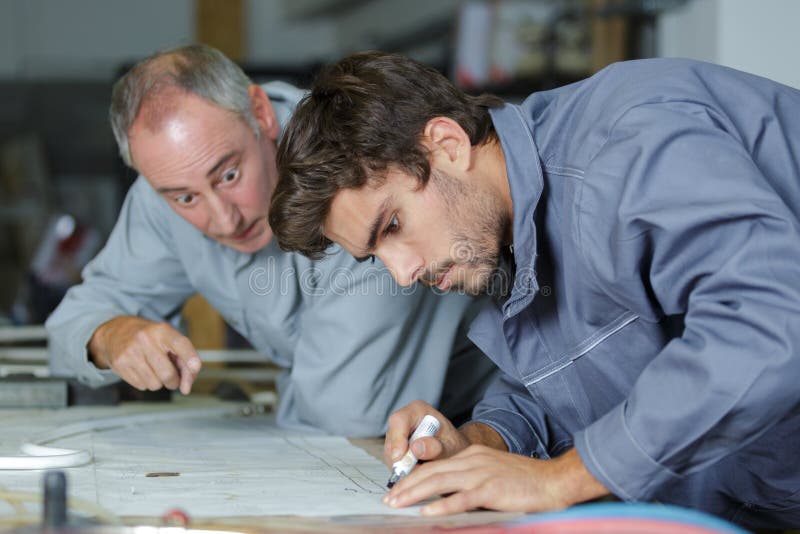 Workman Making Mailbox Plate in Workshop. Stock Photo - Image of tablet ...