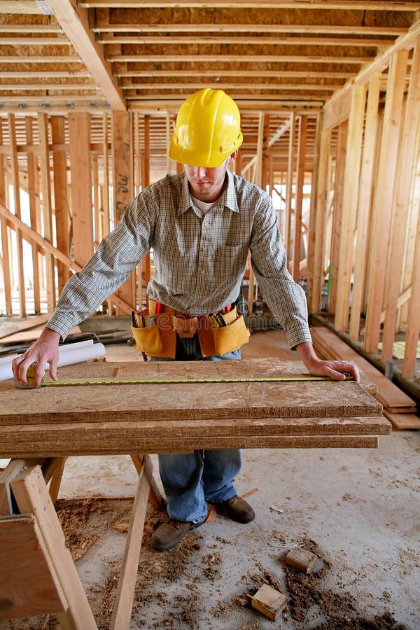 Workman Measuring stock photo. Image of jeans, layout - 2107360