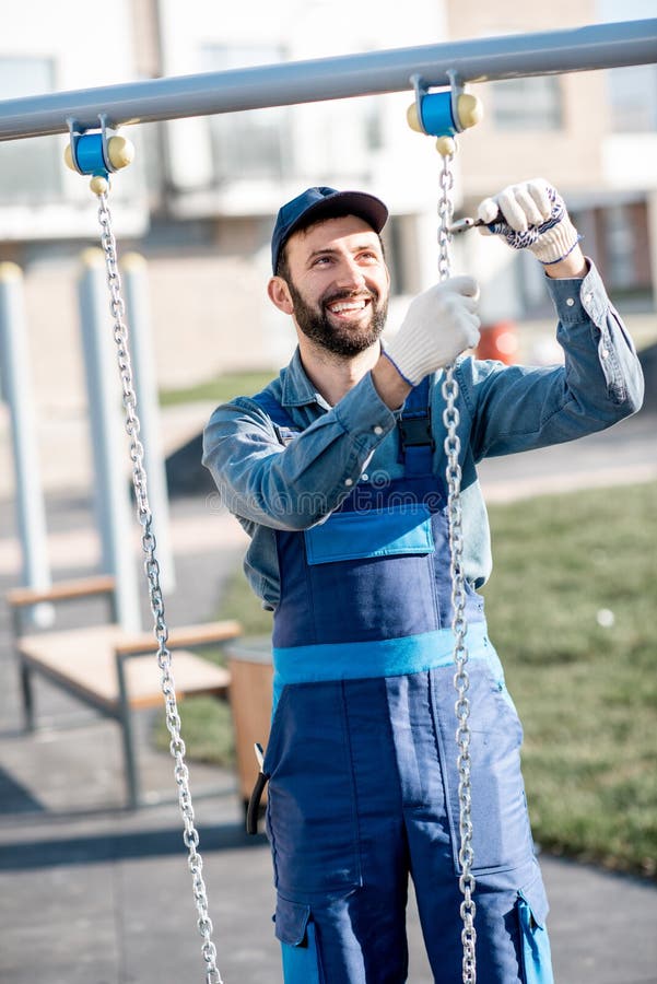 Workman Mounting Playground Stock Image - Image of outside, swing ...
