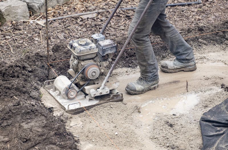 Workman Operating a Power Plate Compactor 1 Stock Photo - Image of ...