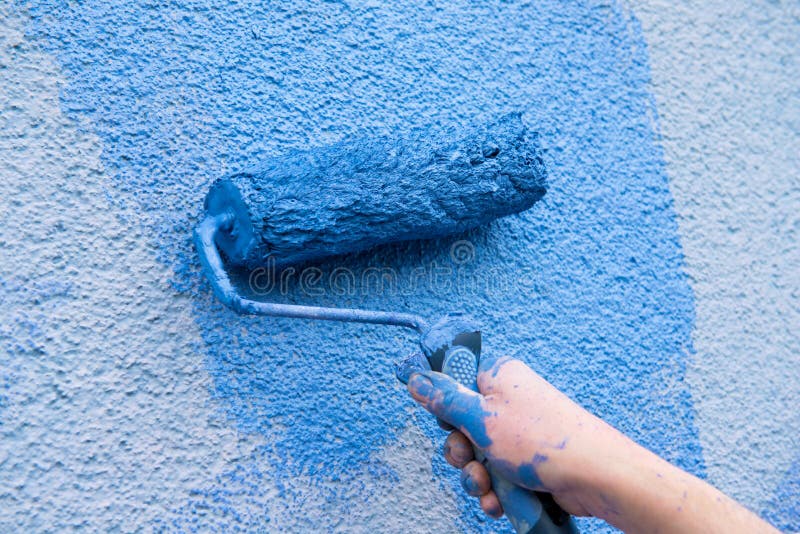 Workman Painting the Wall in Blue Stock Photo - Image of worker, blue ...
