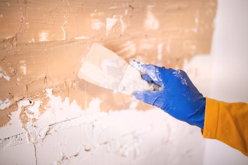 Building Under Construction with Bricklayer Plastering Concrete To ...