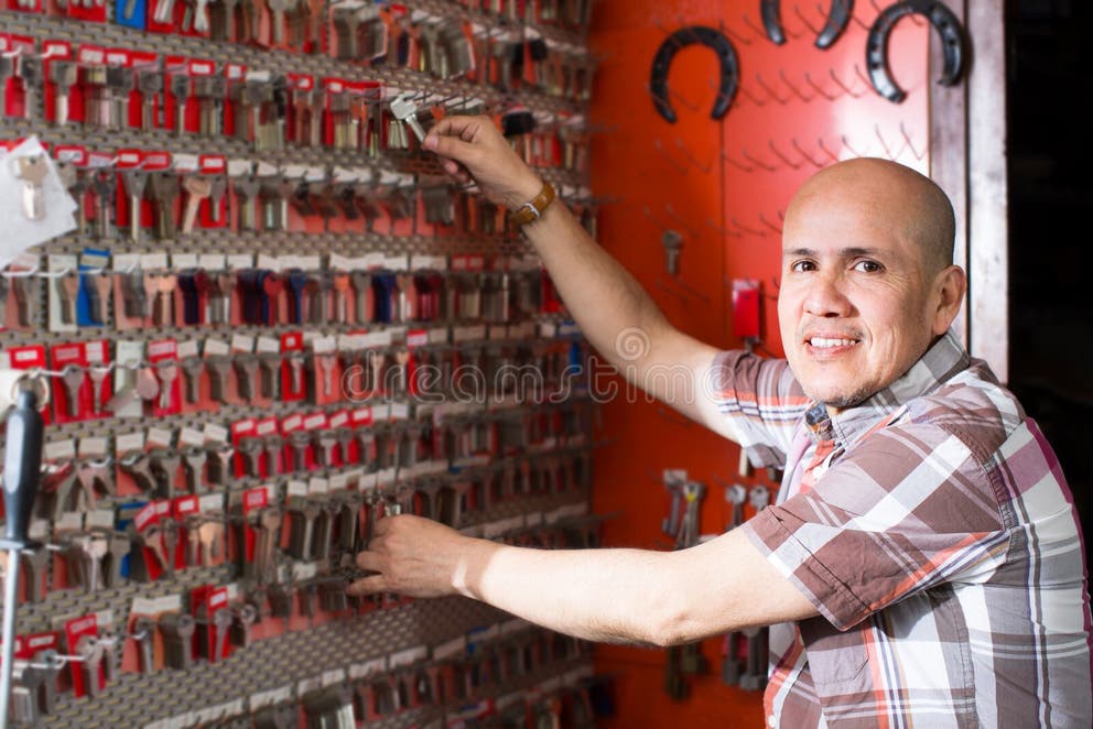 Workman Posing with Door Keys Stock Photo - Image of household, copies ...