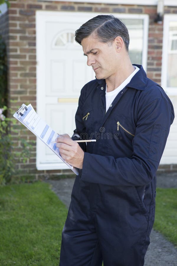 Workman Preparing Estimate for Work on House Exterior Stock Photo ...