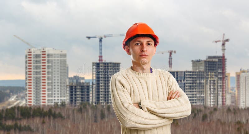Workman in Red Helmet on Background of Buildings Stock Image - Image of ...
