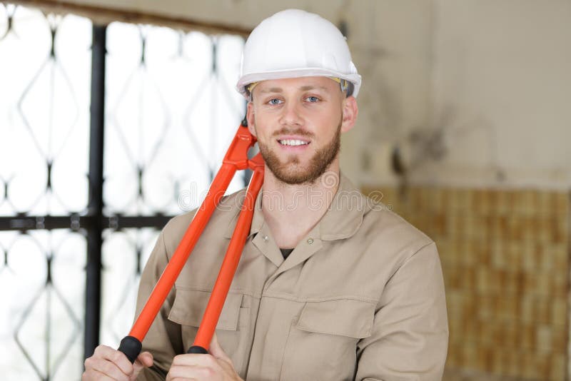 Workman with Scissors Mower Indoors Stock Photo - Image of labour ...
