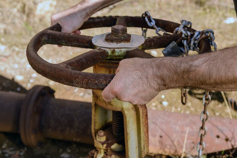 Workman Shunting a valve stock photo. Image of pipelining - 77935368