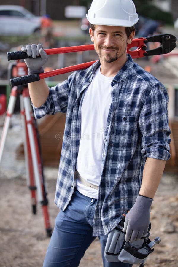 Workman on Site Holding Bolt Croppers on Shoulder Stock Image - Image ...