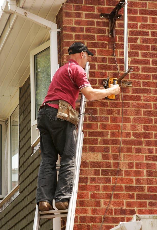 Workman up ladder stock image. Image of drainpipe, pressure - 303029