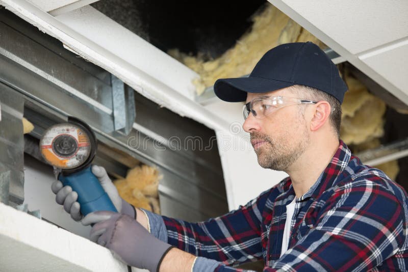 Workman Using Angle Grinder on Metal Stock Photo - Image of site, board ...