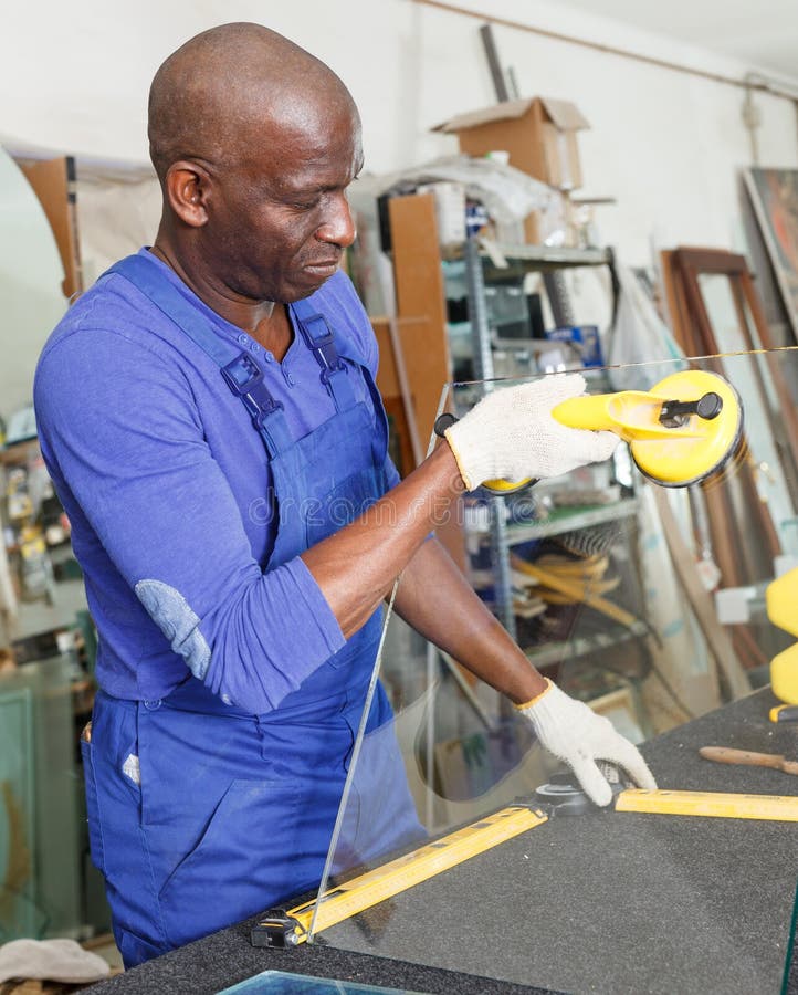 Workman working with glass stock photo. Image of expertise - 269310642