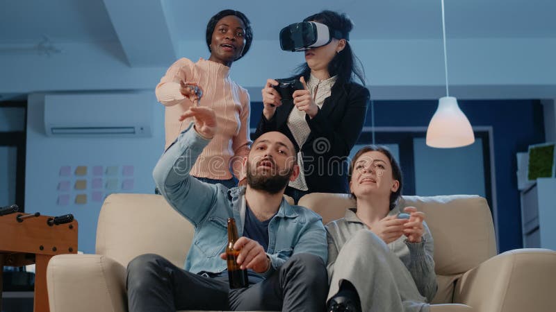 Workmates Using Technology To Play Video Games after Work Stock Photo ...