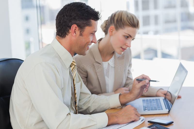 Workmates Working Together on Their Computer Stock Photo - Image of ...