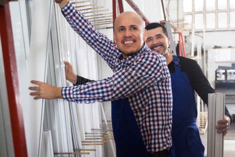 Workmen Carrying Windows Frames from Truck Stock Image - Image of ...