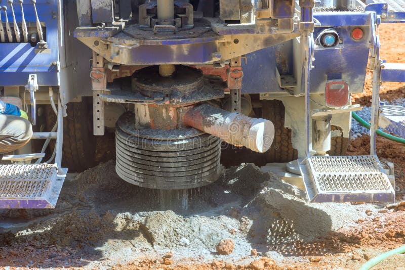 Workmen are Drilling a Water Well in Suburban Yard for Artesian Water ...