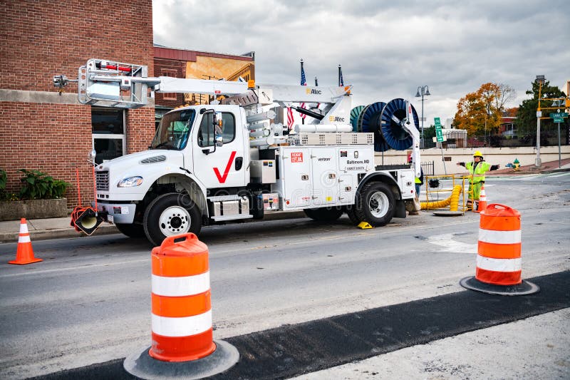 Workmen Verizon Lowering Cable into a Manhole (digital Composite ...