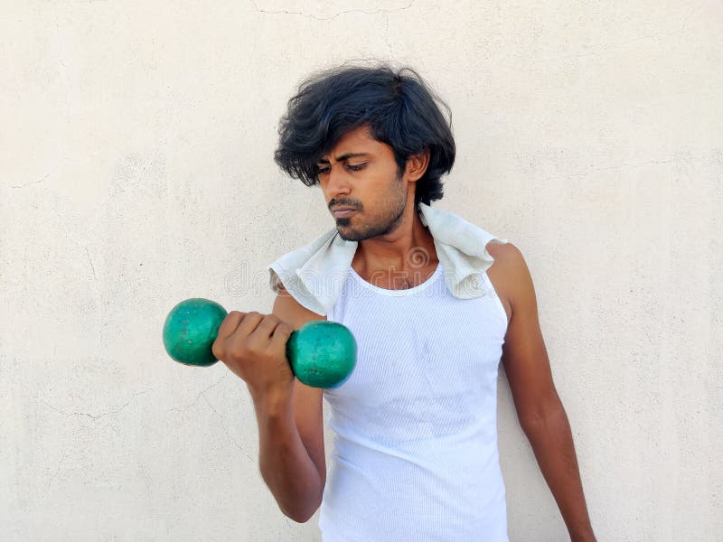 Workout Clothes is Doing Bicep Exercise with Dumbbells Stock Photo ...