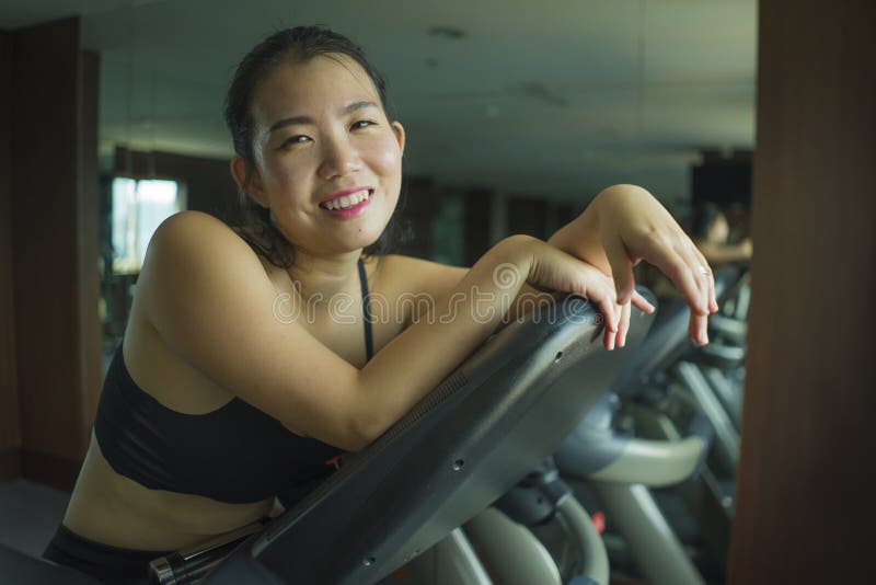 Young Beautiful And Happy Asian Korean Woman Training At Hotel Gym Or Fitness Club Working Hard