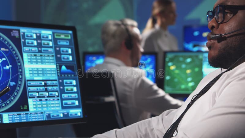 Workplace of the Air Traffic Controllers in the Control Tower. Team of ...
