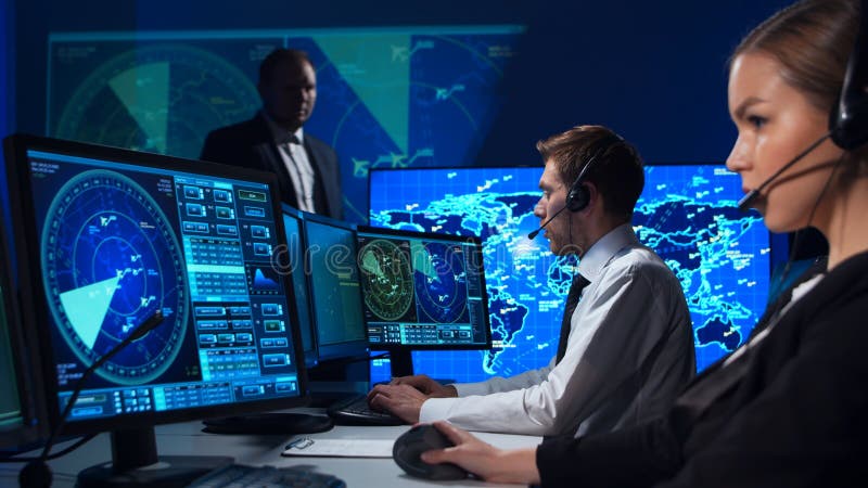 Workplace of the Air Traffic Controllers in the Control Tower. Team of ...