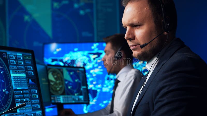 Workplace of the Air Traffic Controllers in the Control Tower. Team of ...