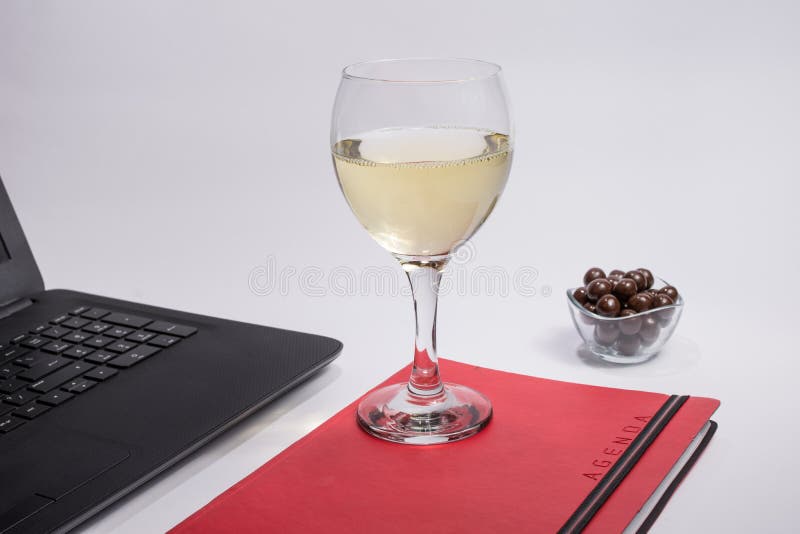 Workplace with Black Laptop Computer, Notebook, Chocolate Balls and ...