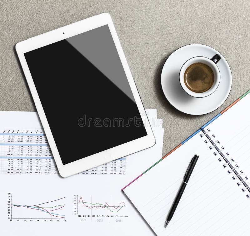 Tablet Pc and a Coffee and Notebook with Pen on the Office Desk Stock ...