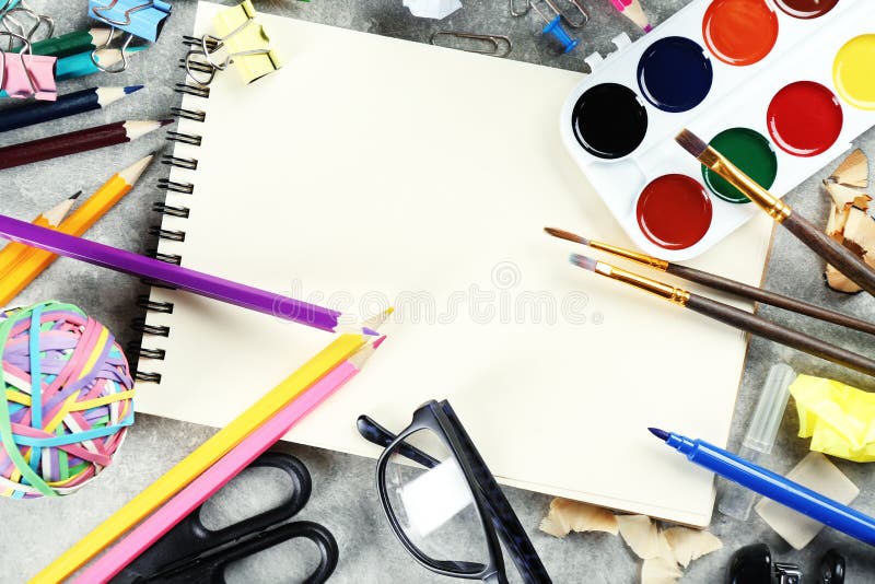 Workplace Composition with Paint, Notebook and Color Pencils on Table ...