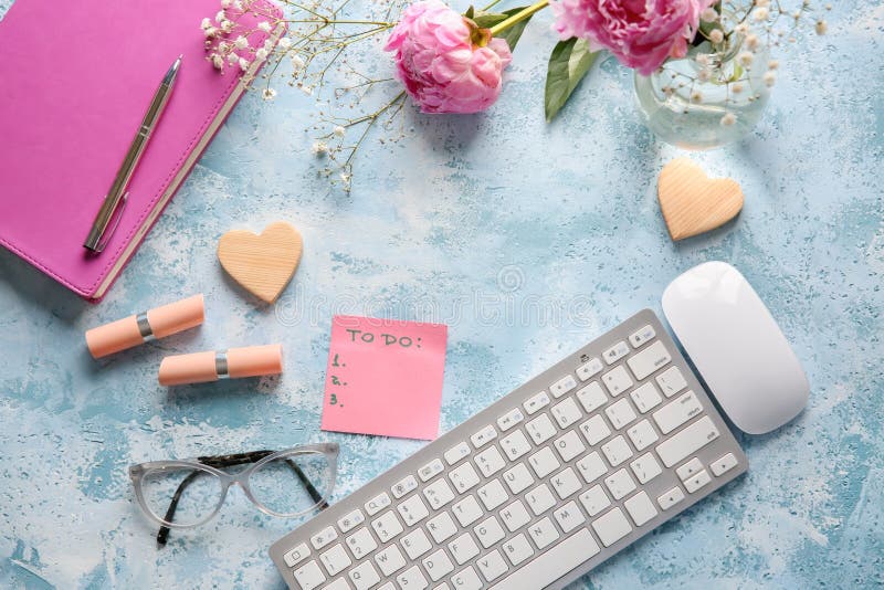Workplace with Computer Keyboard and Beautiful Flowers on Color Table ...