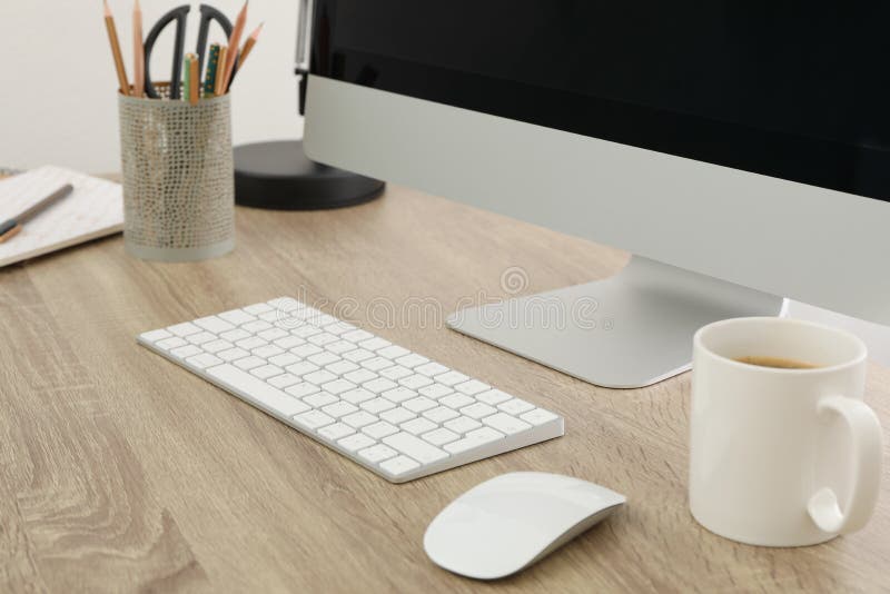 Workplace with Computer, Keyboard and Cup of Coffee on Wood Table ...