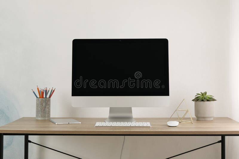 Workplace with Computer, Tablet and Plant on Wood Table Stock Photo ...