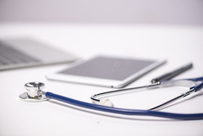 Workplace of Doctor with Laptop and Stethoscope and Notebook on Stock ...