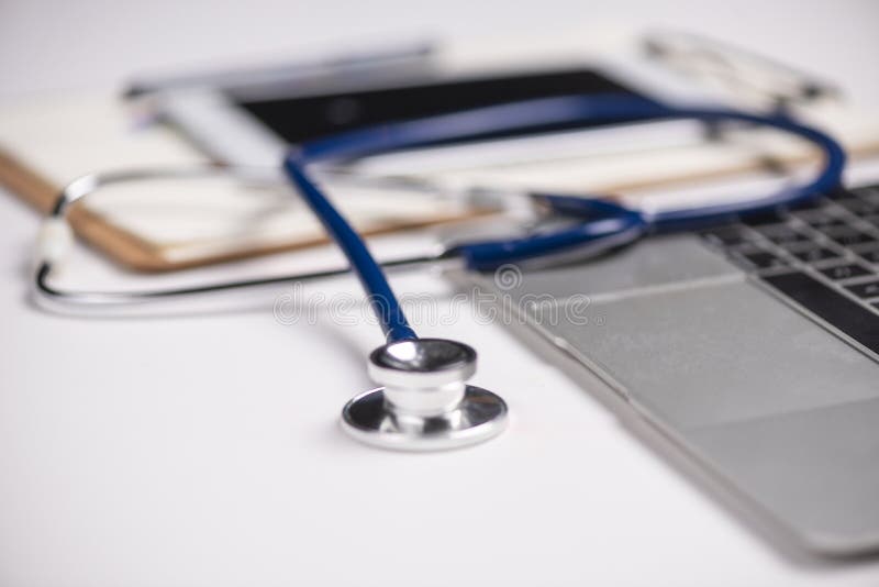 Workplace of Doctor with Laptop and Stethoscope and Notebook on Stock ...