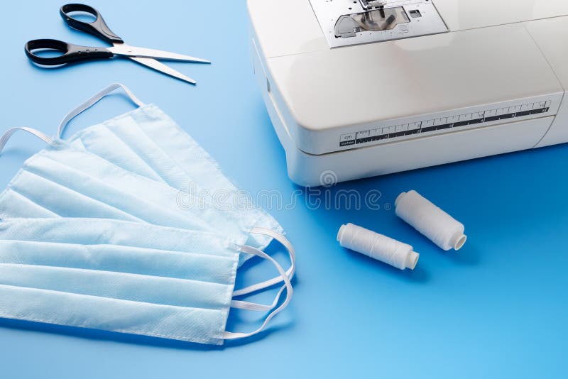 Workplace with Face Masks Sewing Threads, Scissors and Sewing Machine ...