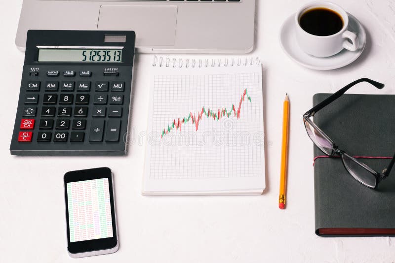 Workplace with Financial Schedule, Phone, Computer, Calculator and a ...