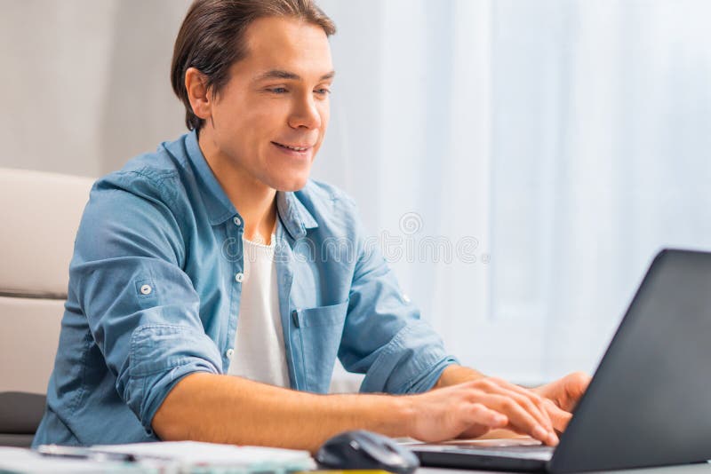 Workplace of Freelance Worker at Home Office. Young Man Works Using ...