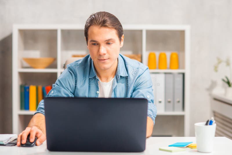 Workplace of Freelance Worker at Home Office. Young Man Works Using ...