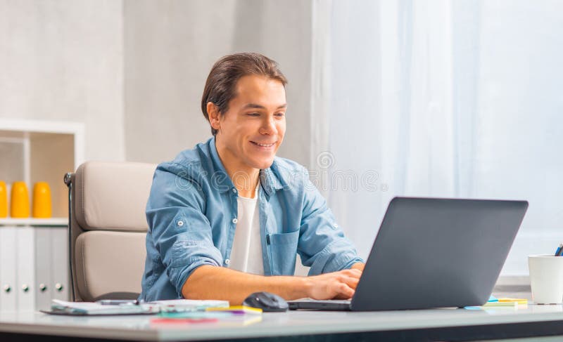 Workplace of Freelance Worker at Home Office. Young Man Works Using ...