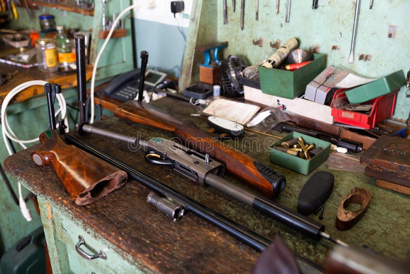 Workplace of Gunsmith in Weapons Workshop with Tools and Disassembled ...