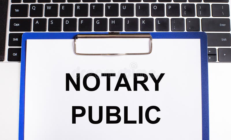 A Workplace with a Keyboard and a Tablet for Papers with NOTARY PUBLIC ...