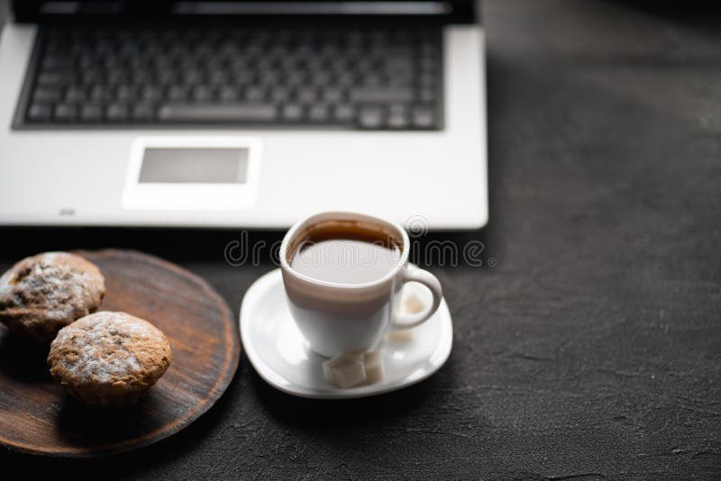 Workplace with Laptop Computer, Coffee and Treats Stock Photo - Image ...
