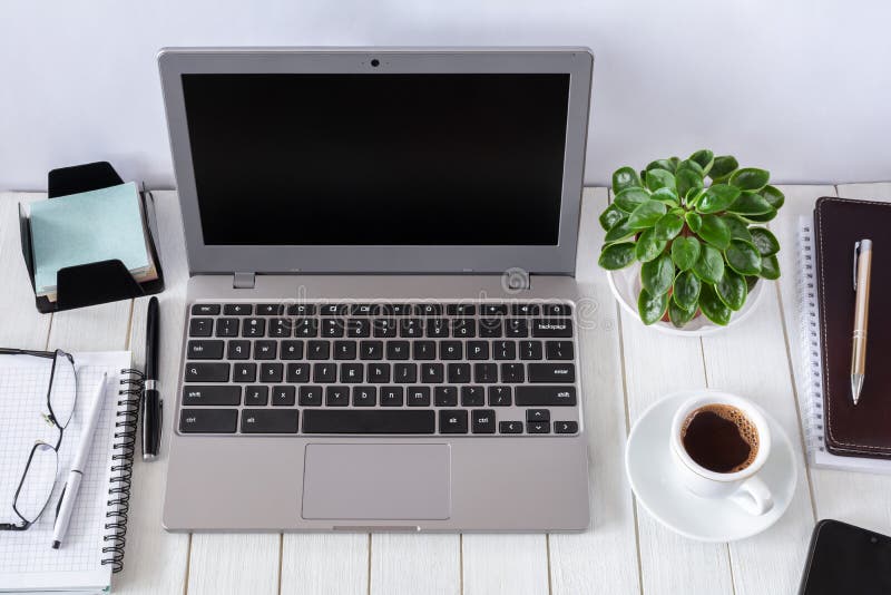 Workplace. a Laptop, a Cup of Coffee, Notebooks and Other Items on a ...