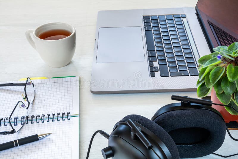 Workplace with Laptop, Notepad and Cup of Tea on White Desktop Stock ...