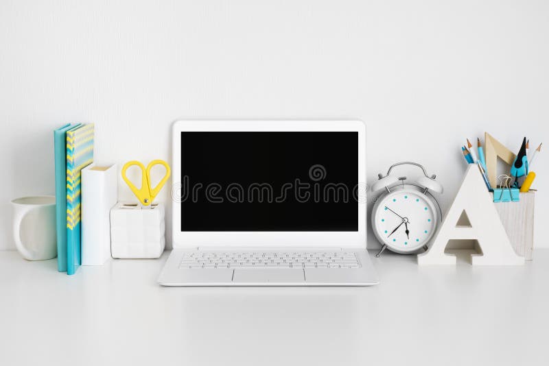 On the Table are Business Charts, Office Supplies and a Notepad with ...