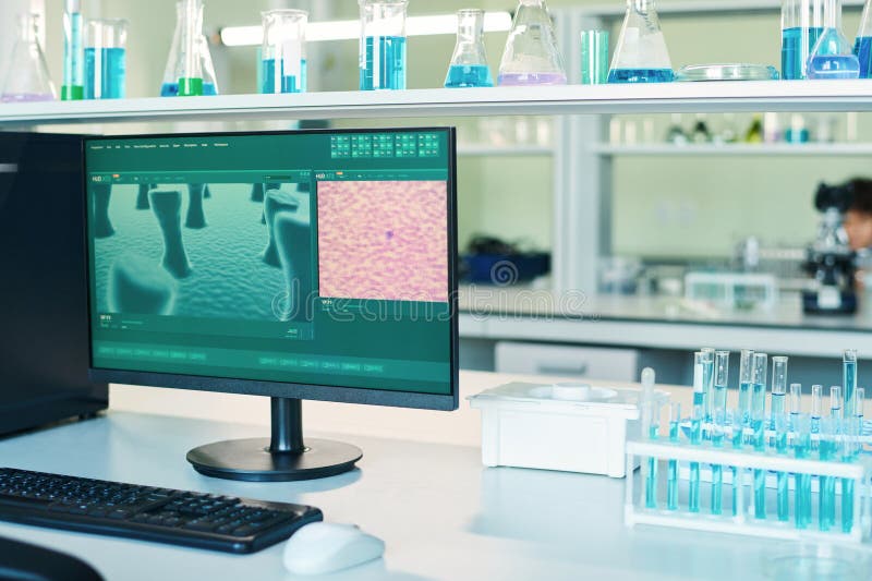 Workplace of Modern Clinician with Computer Screen and Group of Test ...